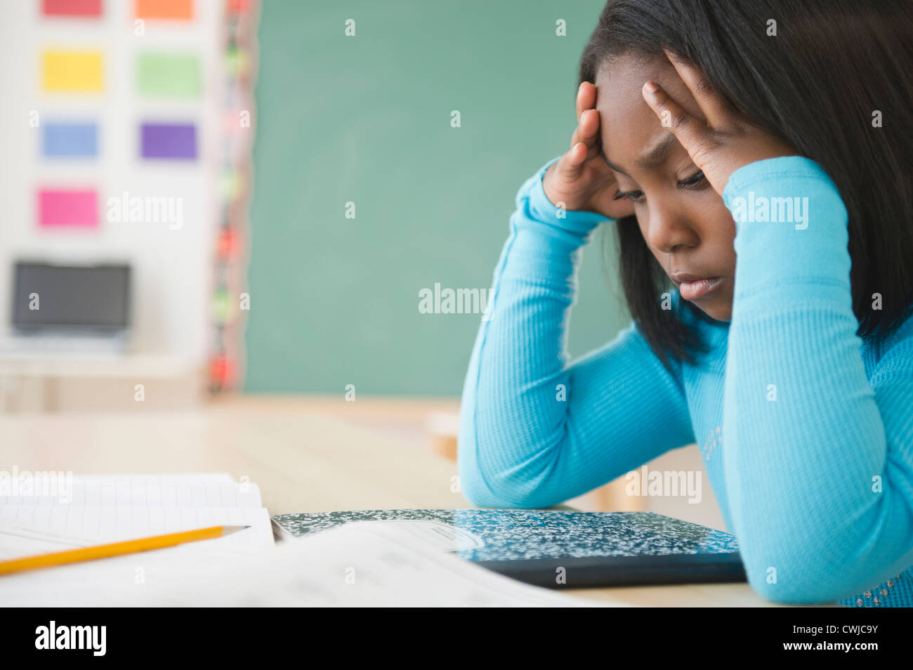 Black student studying in classroom Stock Photo - Alamy
