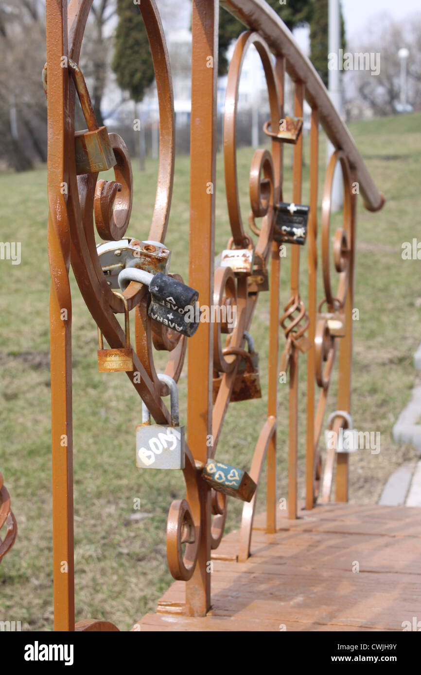 Belarus. Minsk. Bridge with locks in the Church of the Krupetskii icon ...