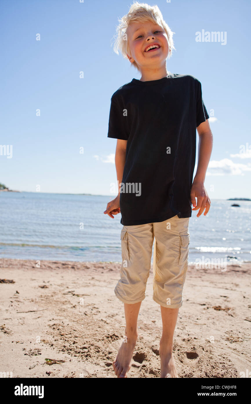 Boy on the beach on a beautiful sunny summer day Stock Photo - Alamy
