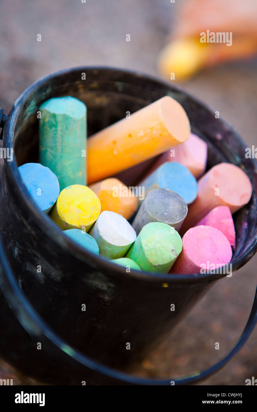 Bucket of colorful crayons outdoors for drawing Stock Photo - Alamy