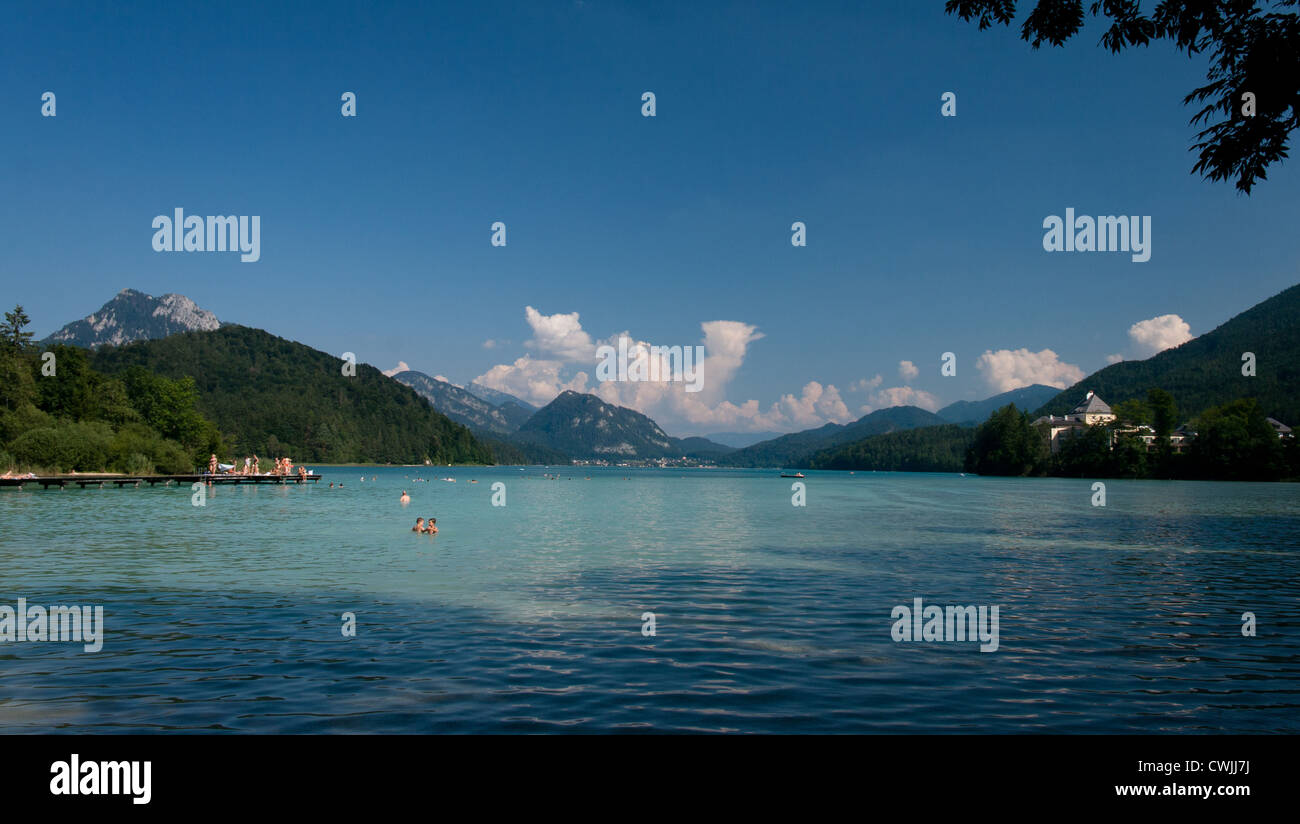 People swimming in lake Fuschlsee in the Salzkammergut district in ...