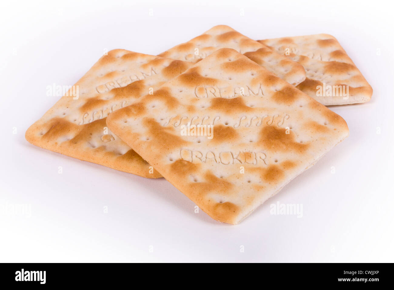Cream Crackers on white background Stock Photo - Alamy