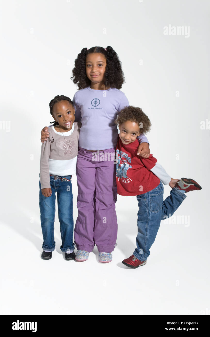 Three children smiling Stock Photo - Alamy