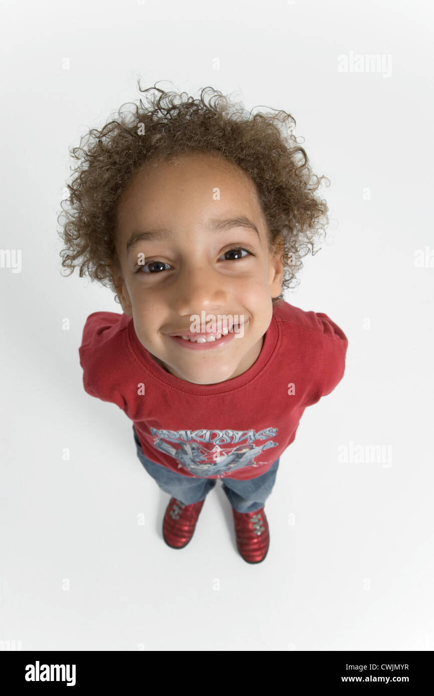 Little boy looking up and smiling Stock Photo - Alamy