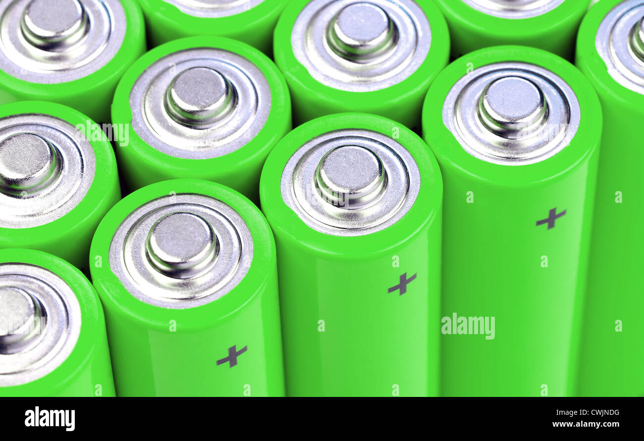 Concept background of green batteries Stock Photo - Alamy