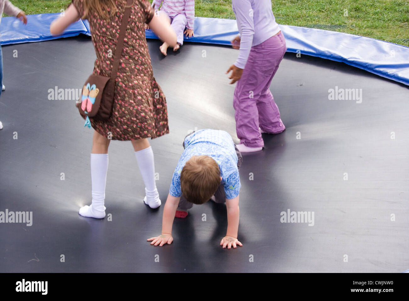 Children playing on a trampoline Stock Photo - Alamy