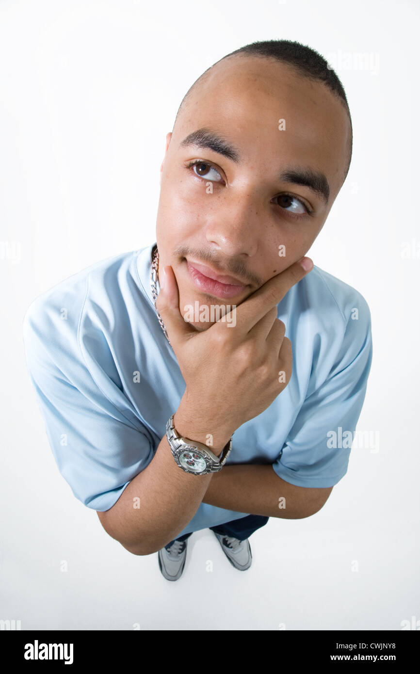 Teenage boy looking thoughtful Stock Photo - Alamy