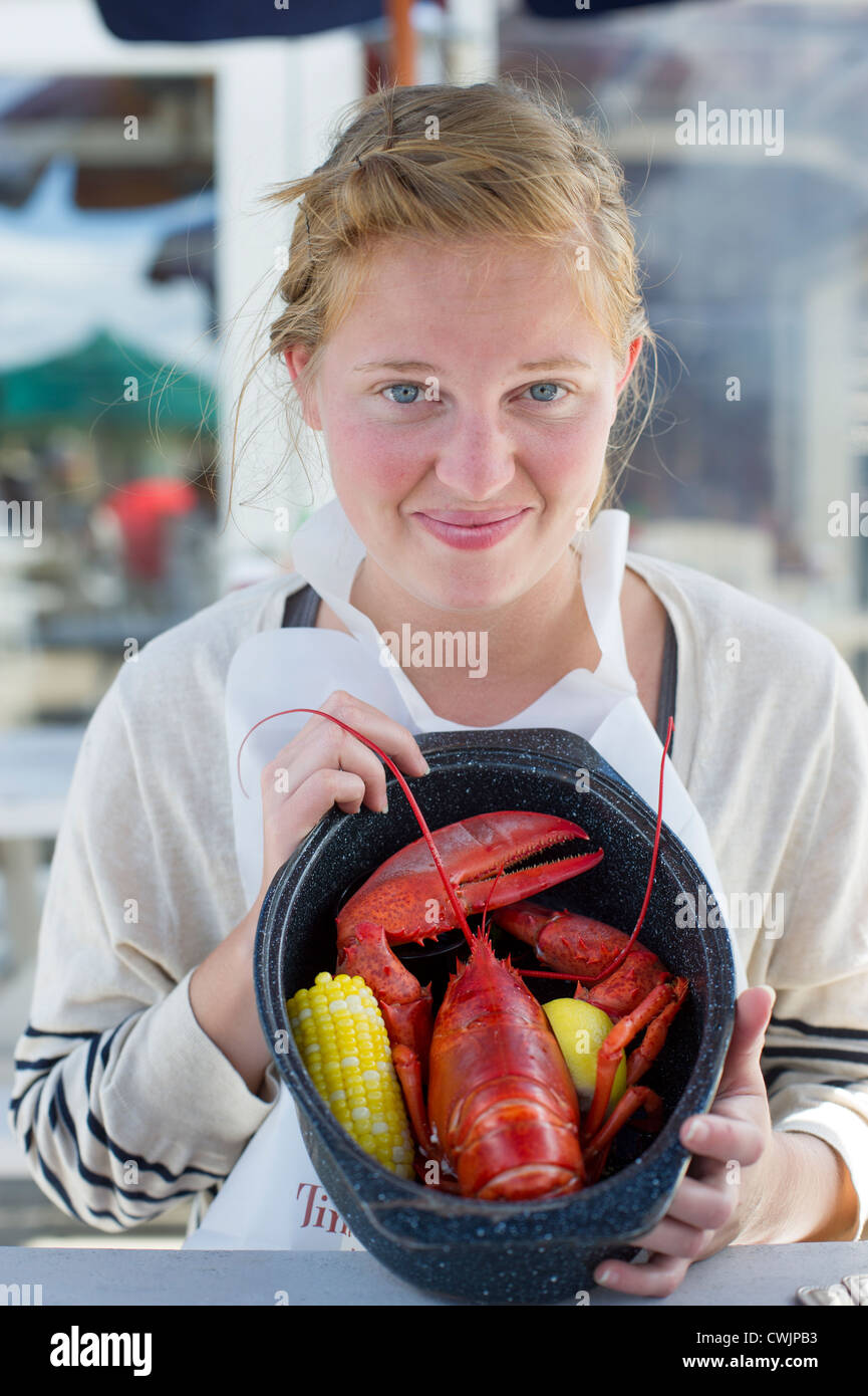 Young woman eating lobster on vacation, Bar Harbor Maine USA Stock ...