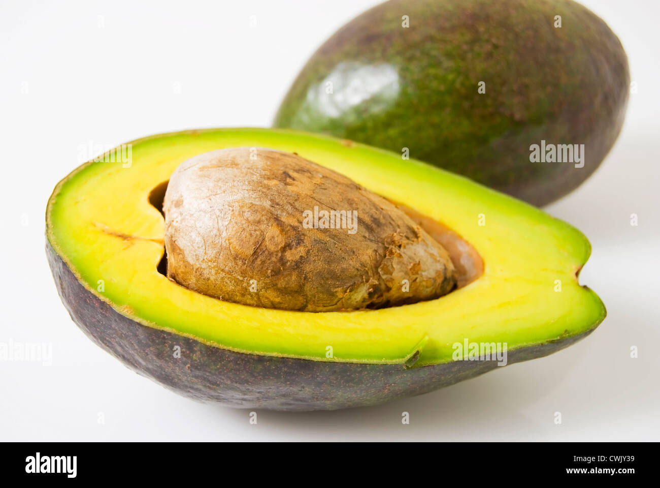 Avocado on wooden place mat Stock Photo - Alamy