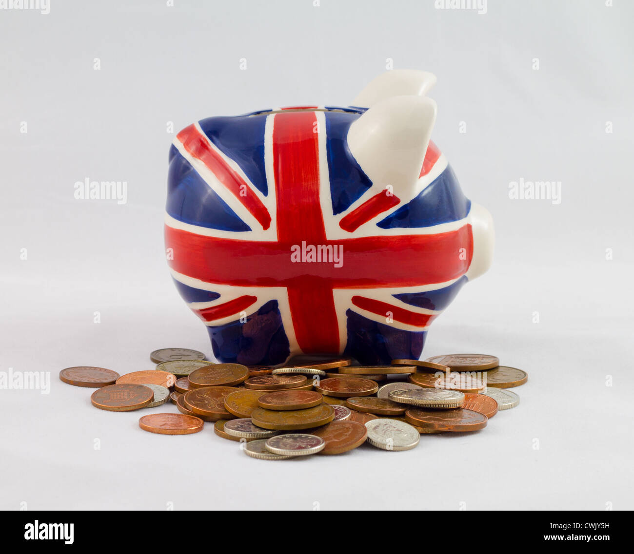 British Piggy Bank with Coins Stock Photo - Alamy