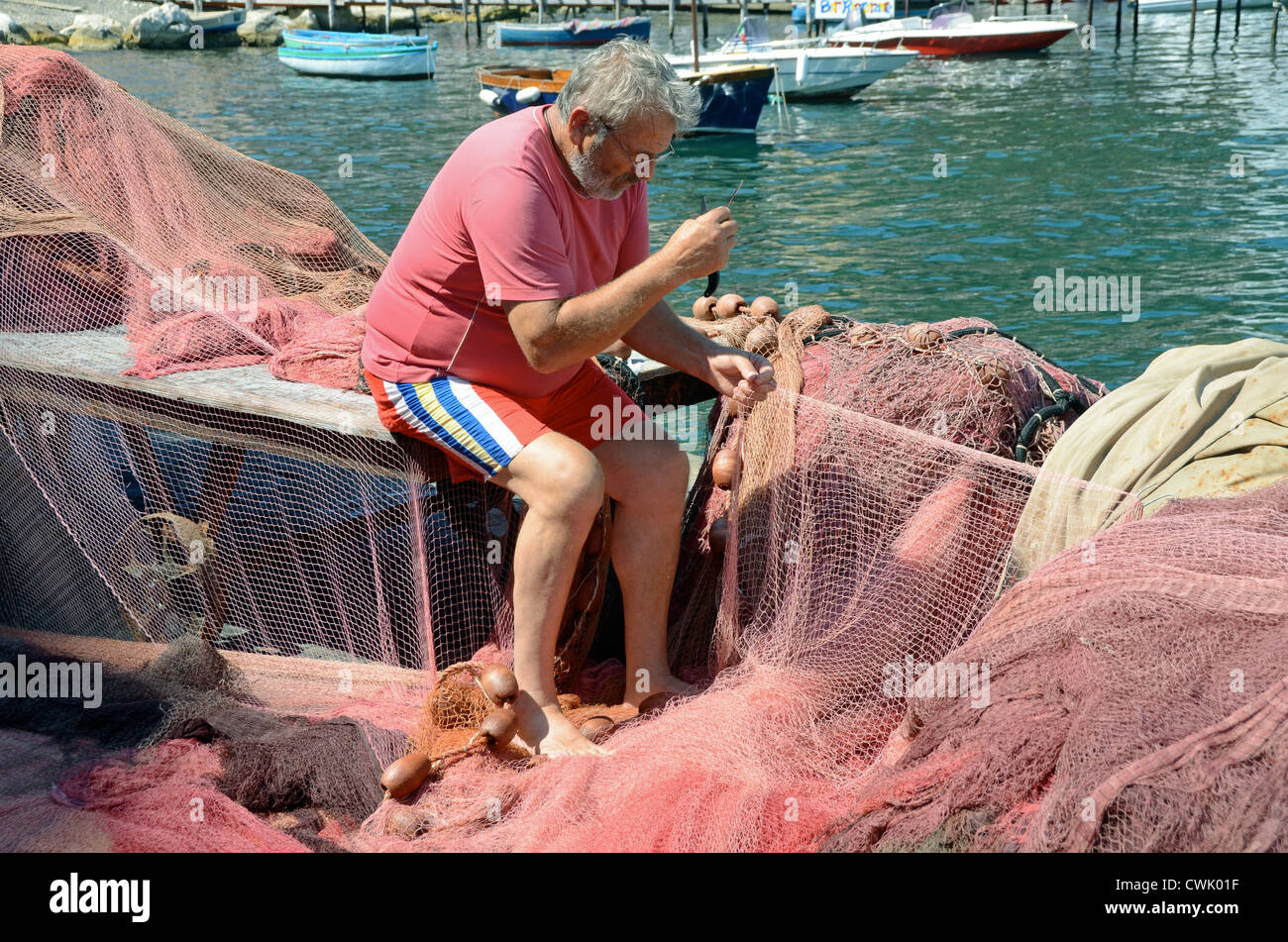 Mending nets holes hi-res stock photography and images - Alamy