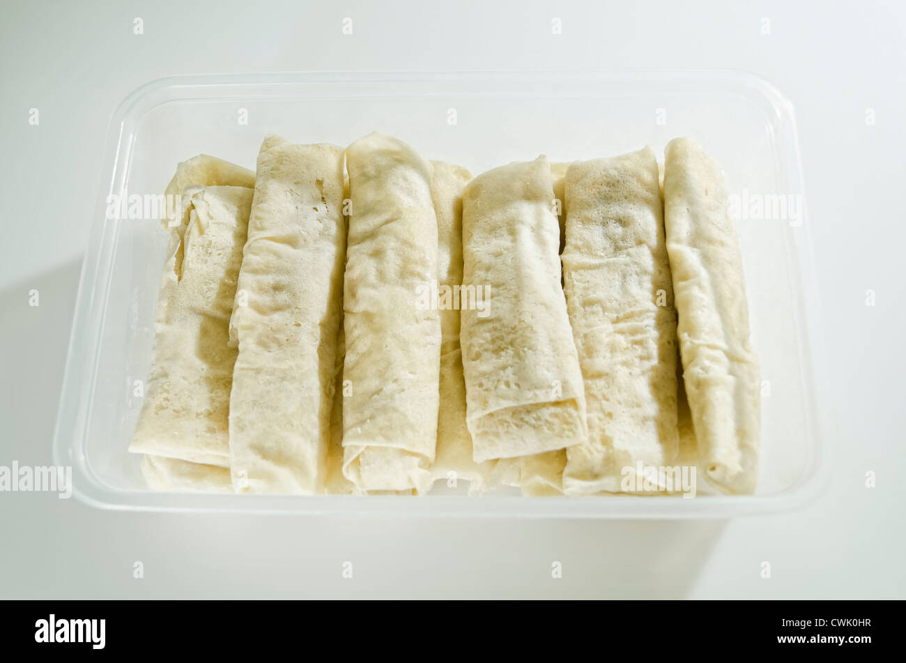 Bananas in spring roll inside plastic container Stock Photo - Alamy