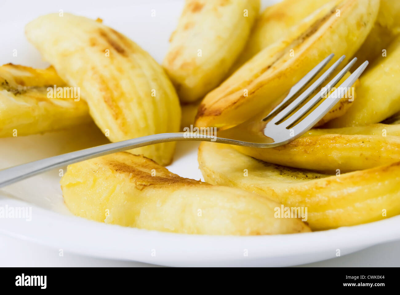Sliced bananas sprinkled with brown sugar, then fried Stock Photo - Alamy