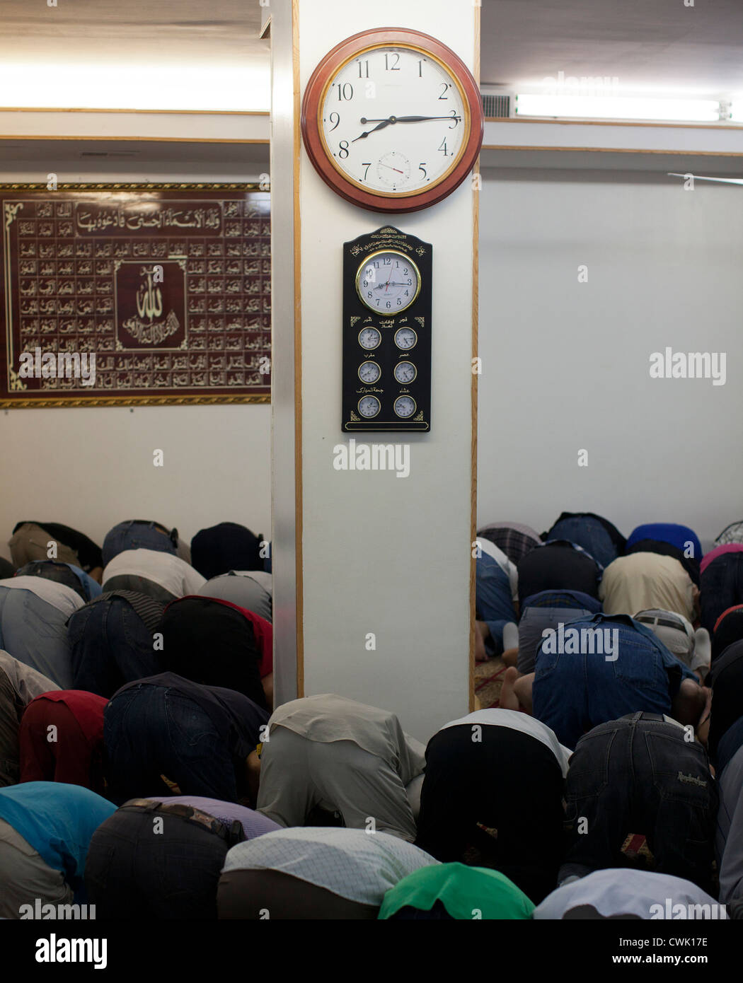 Muslim-American men perform evening prayers at the Islamic Society of ...