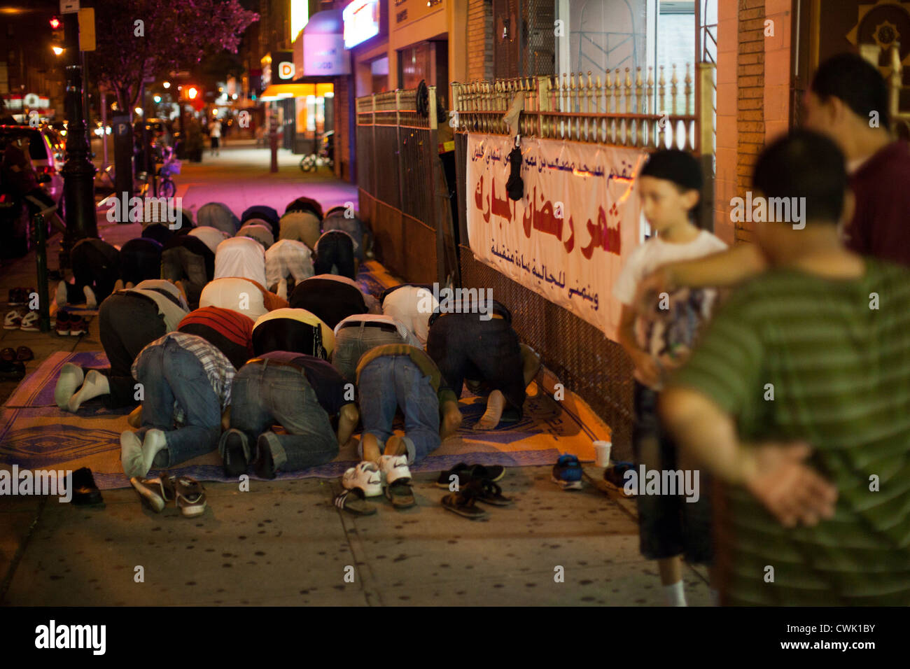 Muslim-American men perform prayers outside the Islamic Society of Bay ...