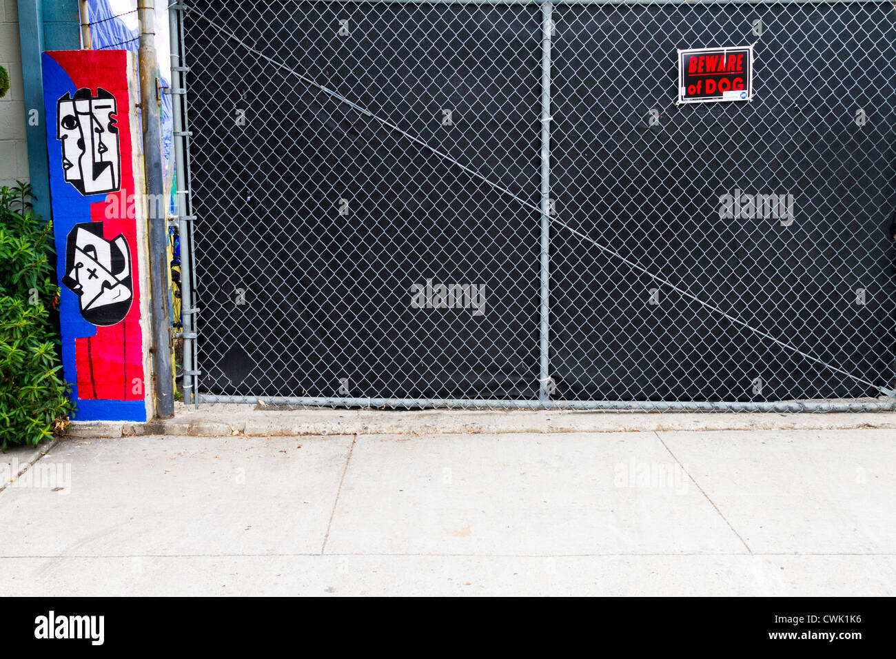 Gate with signs Stock Photo - Alamy