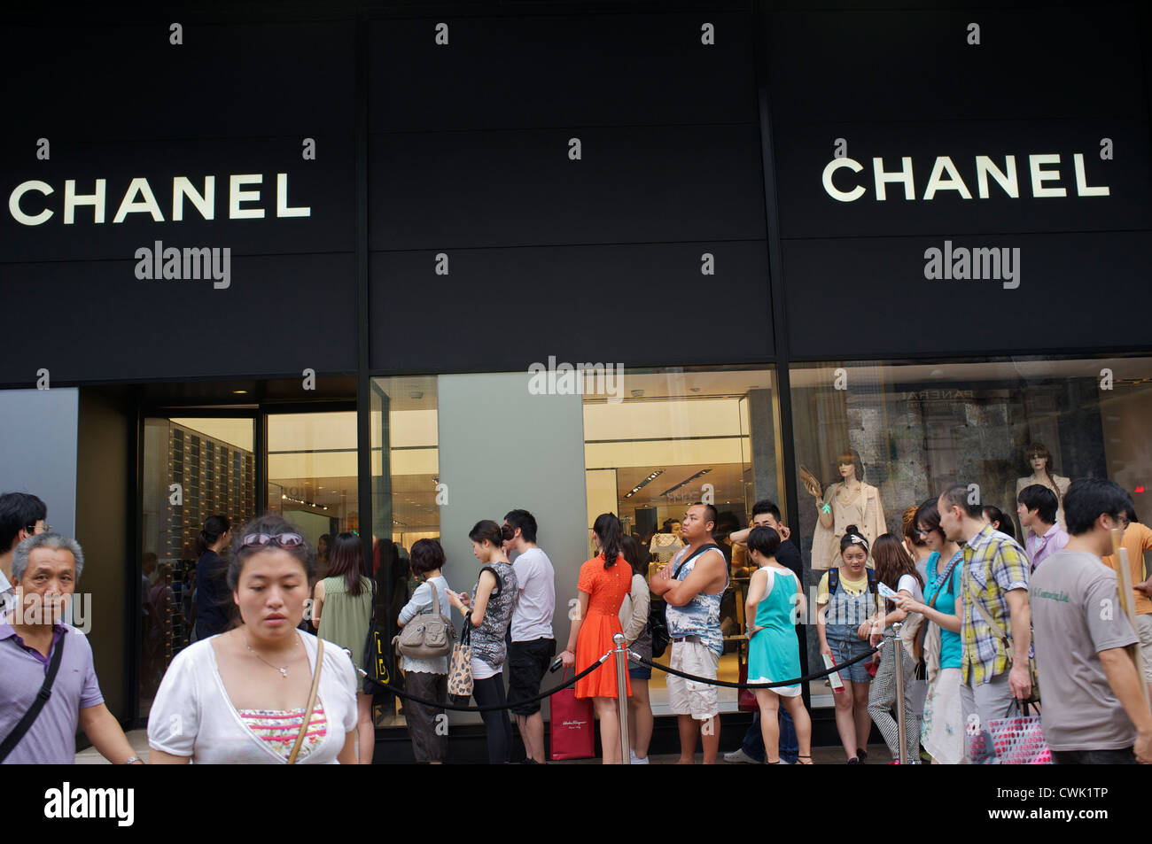People queuing to shop in a CHANEL store in Tsim Sha Tsui, Hong Kong ...