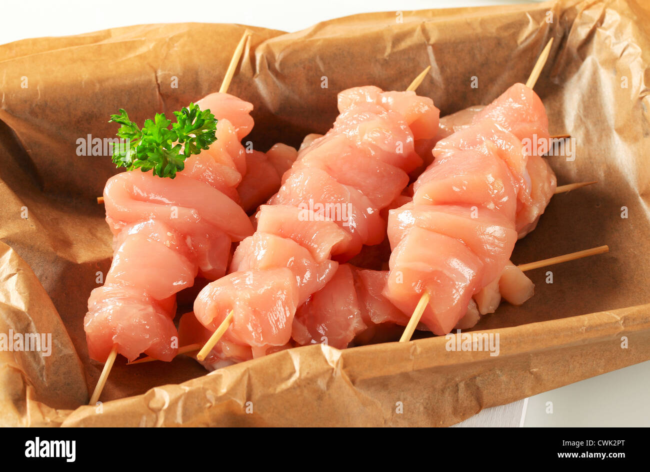 Raw chicken cubes on wooden skewers Stock Photo - Alamy