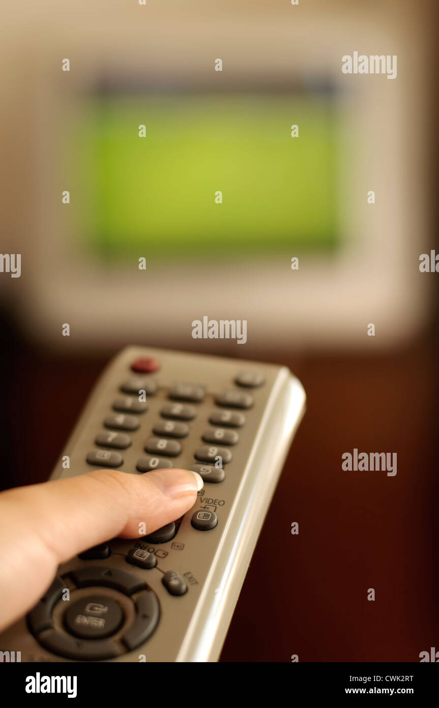 Remote watching tv hi-res stock photography and images - Alamy
