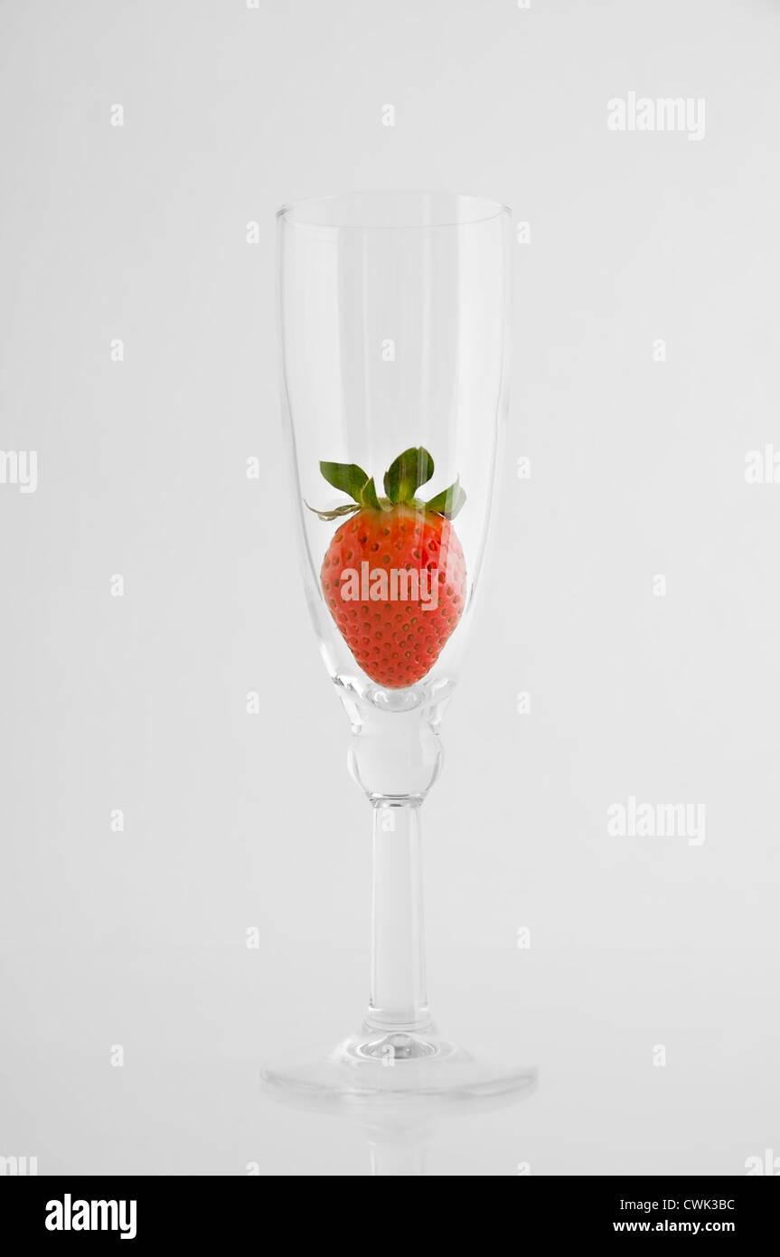 Close-up of bright red strawberry inside wine glass Stock Photo - Alamy