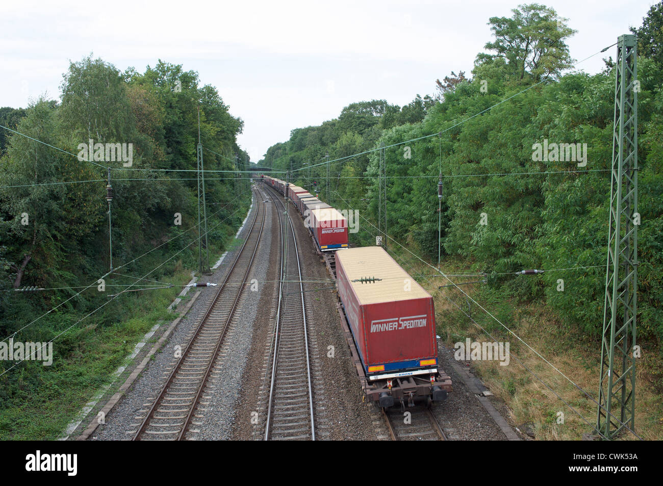 German Railways freight train loaded with Winner Spedition trucks ...