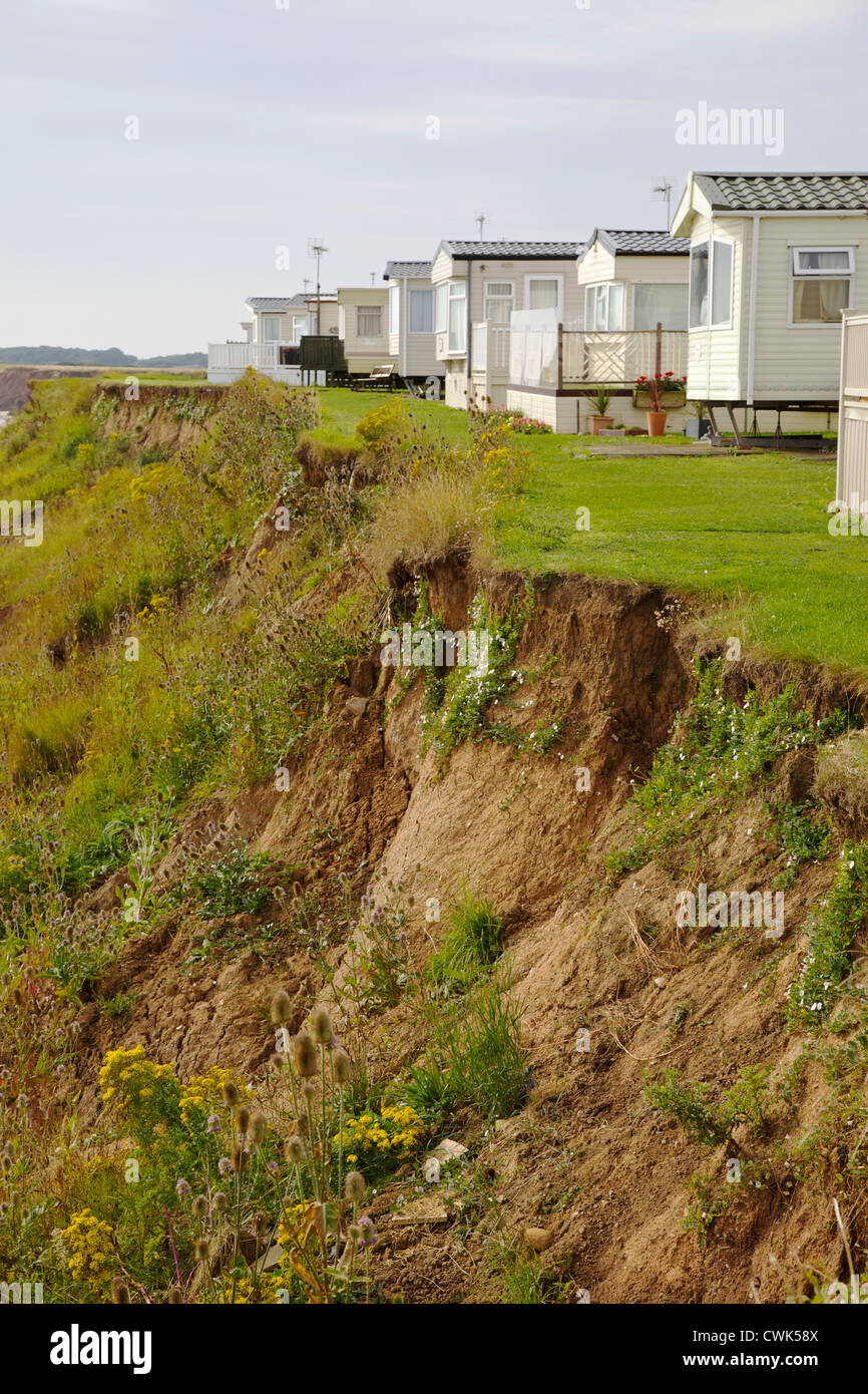 Static caravans perched precariously on the eroding cliffs at Hornsea ...