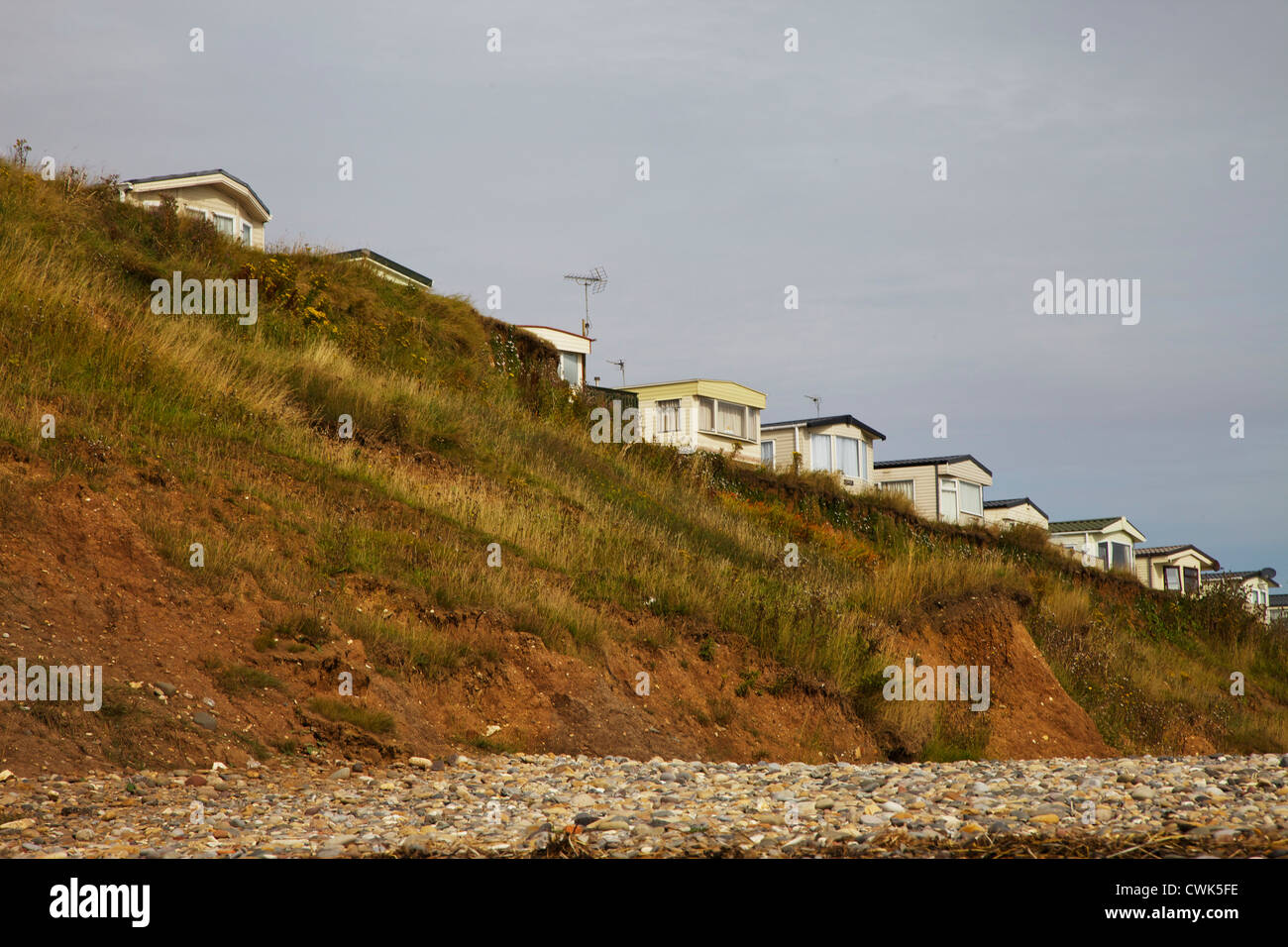 Static caravans perched precariously on the eroding cliffs at Hornsea ...
