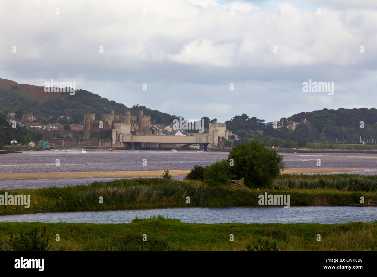 The tubular railway bridge across the Conwy river as seen across the ...