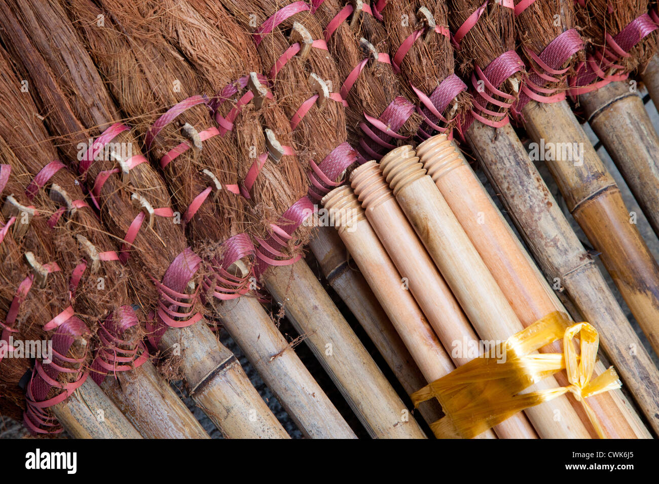 Asia, China, Hong Kong. A display of handmade straw dust brooms for ...
