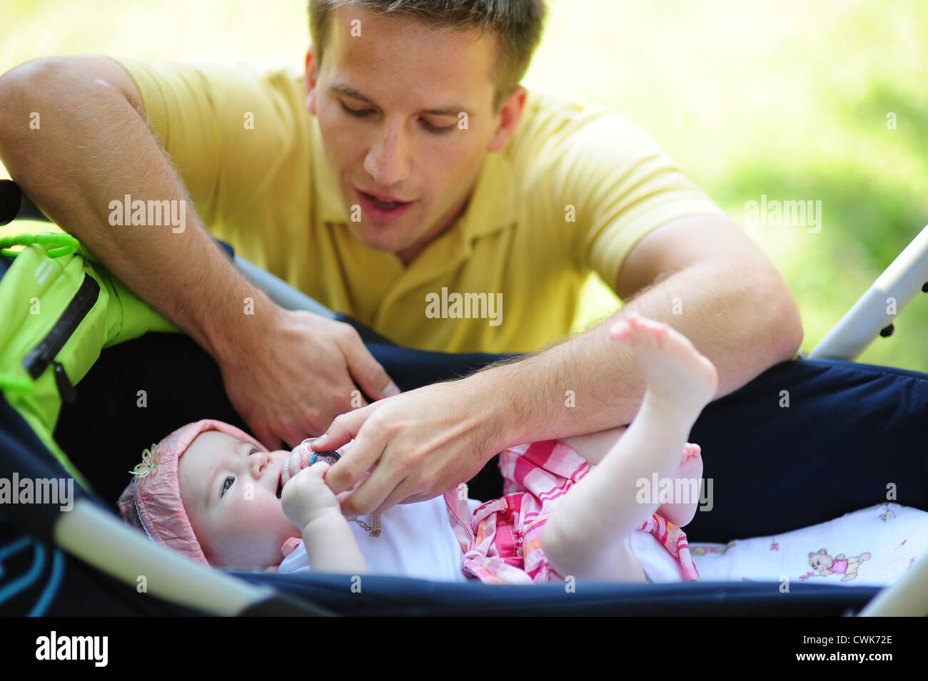 Young man and a baby Stock Photo - Alamy