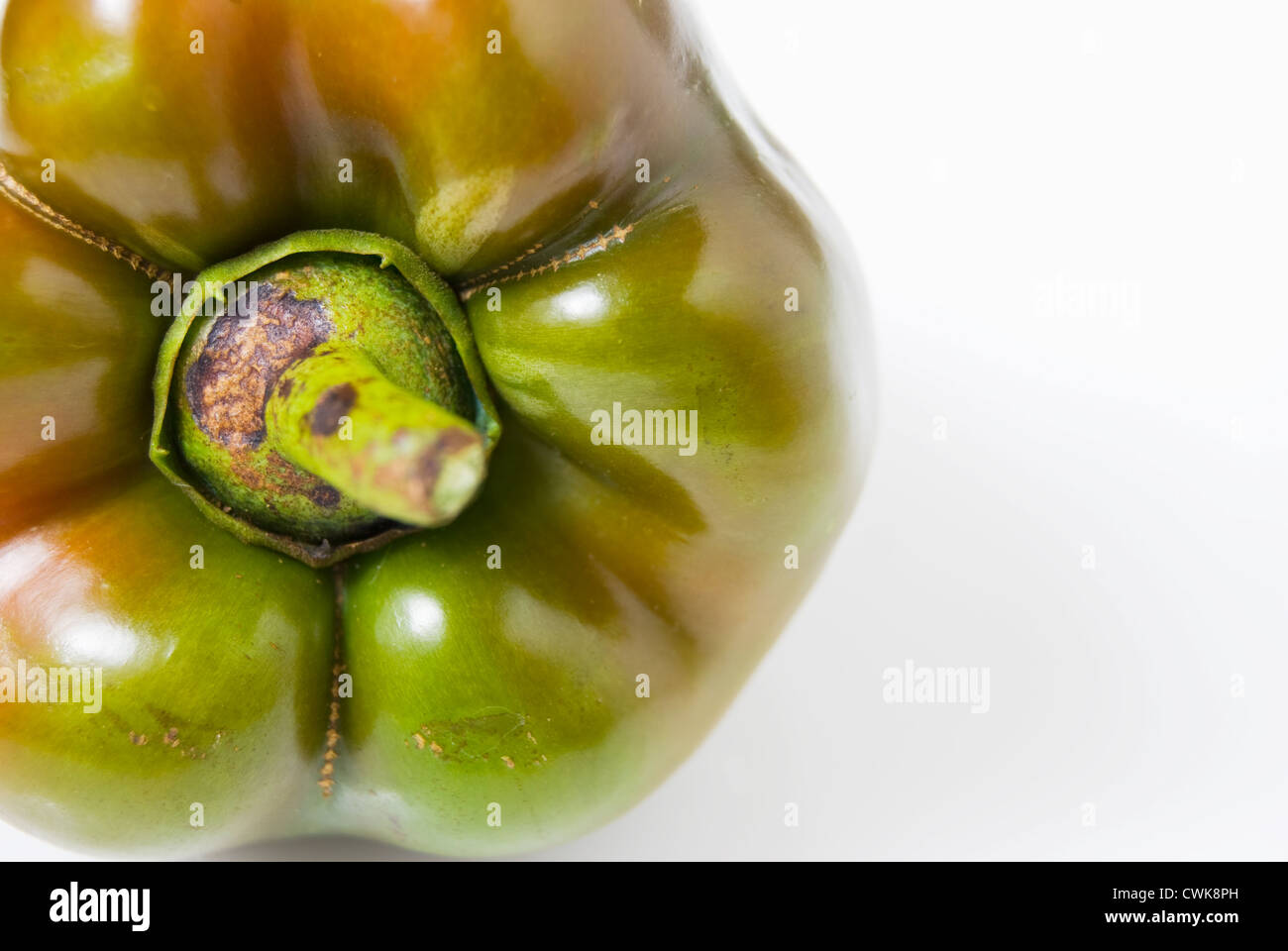 Shiny green bell pepper on white background Stock Photo - Alamy
