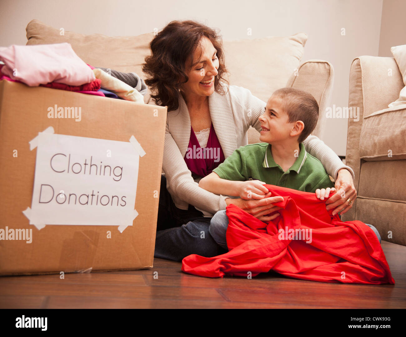 Caucasian grandmother and granddaughter donating clothing Stock Photo ...
