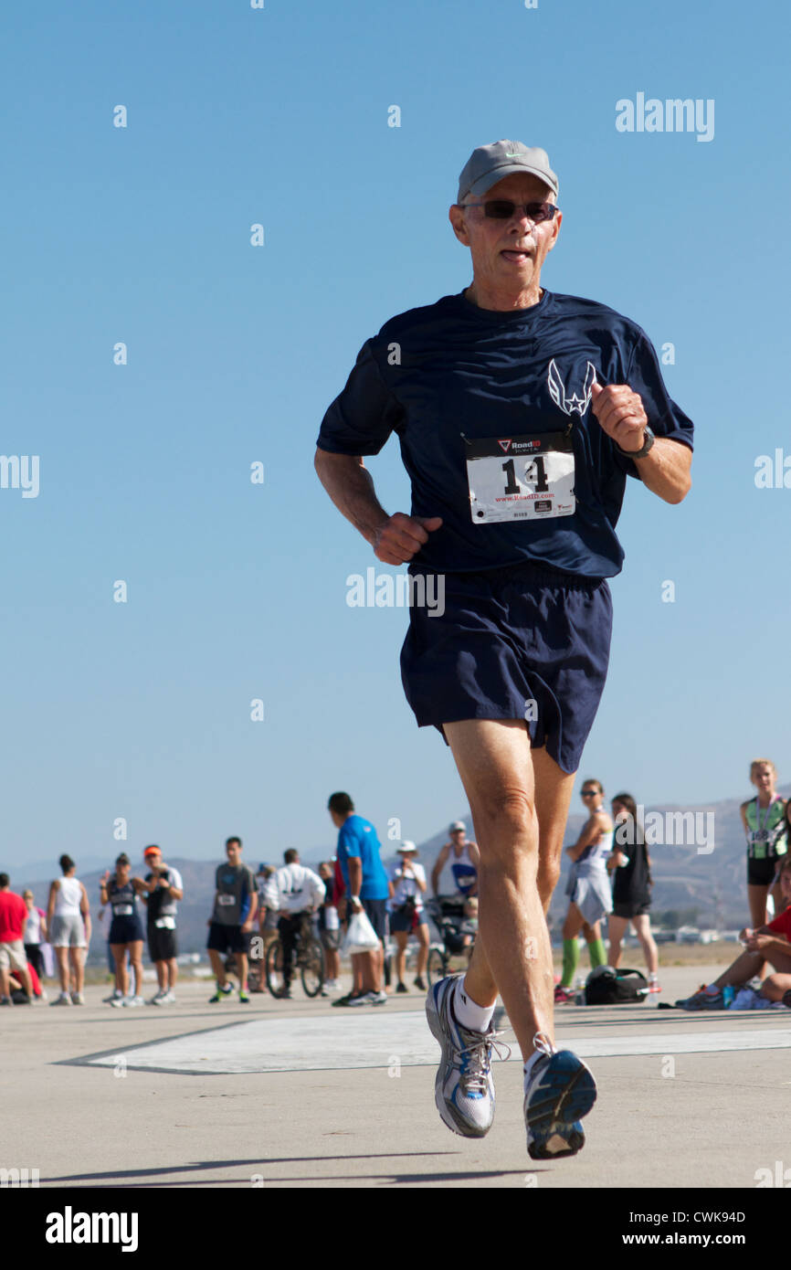 Senior man running outside hi-res stock photography and images - Alamy