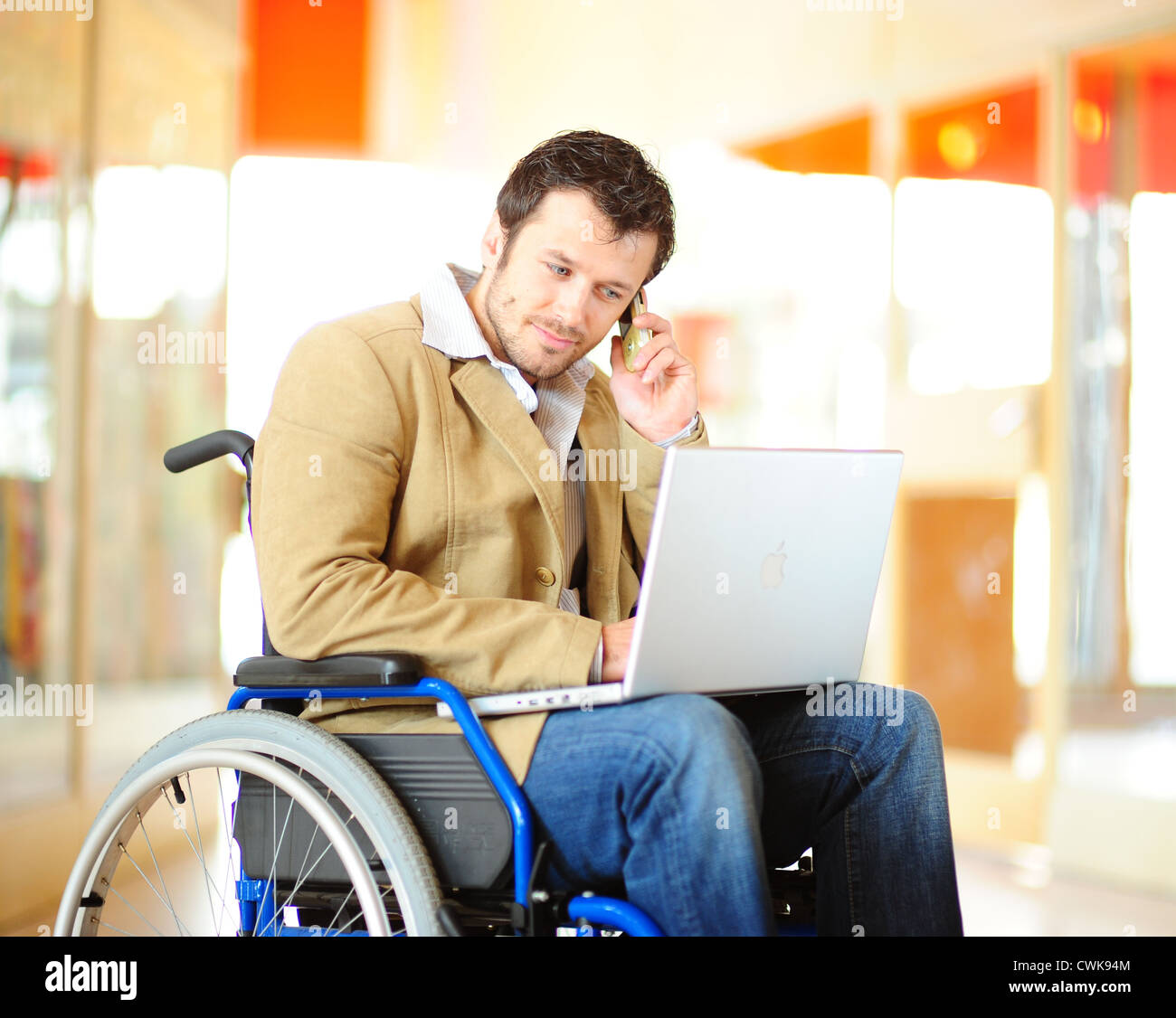 Working wheelchair user Stock Photo - Alamy