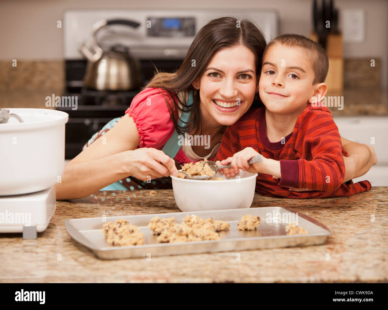 Caucasian mother and son baking cookies Stock Photo - Alamy