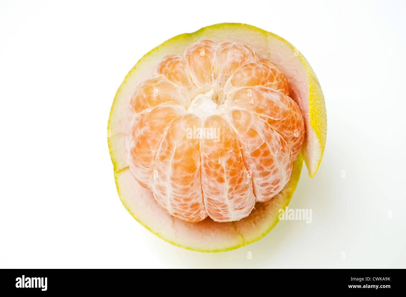 Ripe pomelo with its rind against white background Stock Photo - Alamy