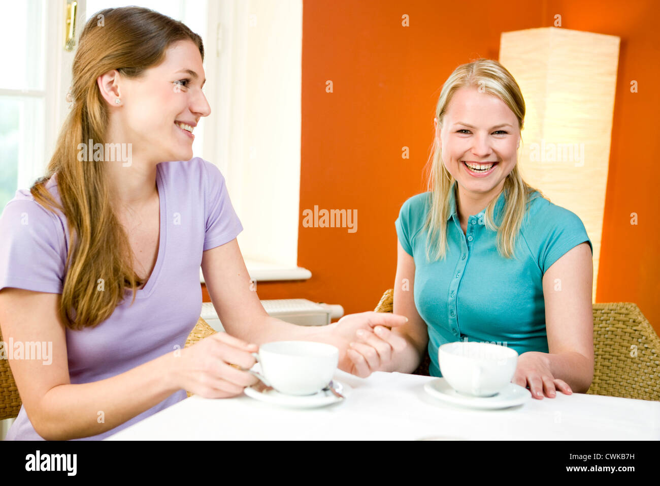 Two Girlfriends at Cafe Stock Photo - Alamy