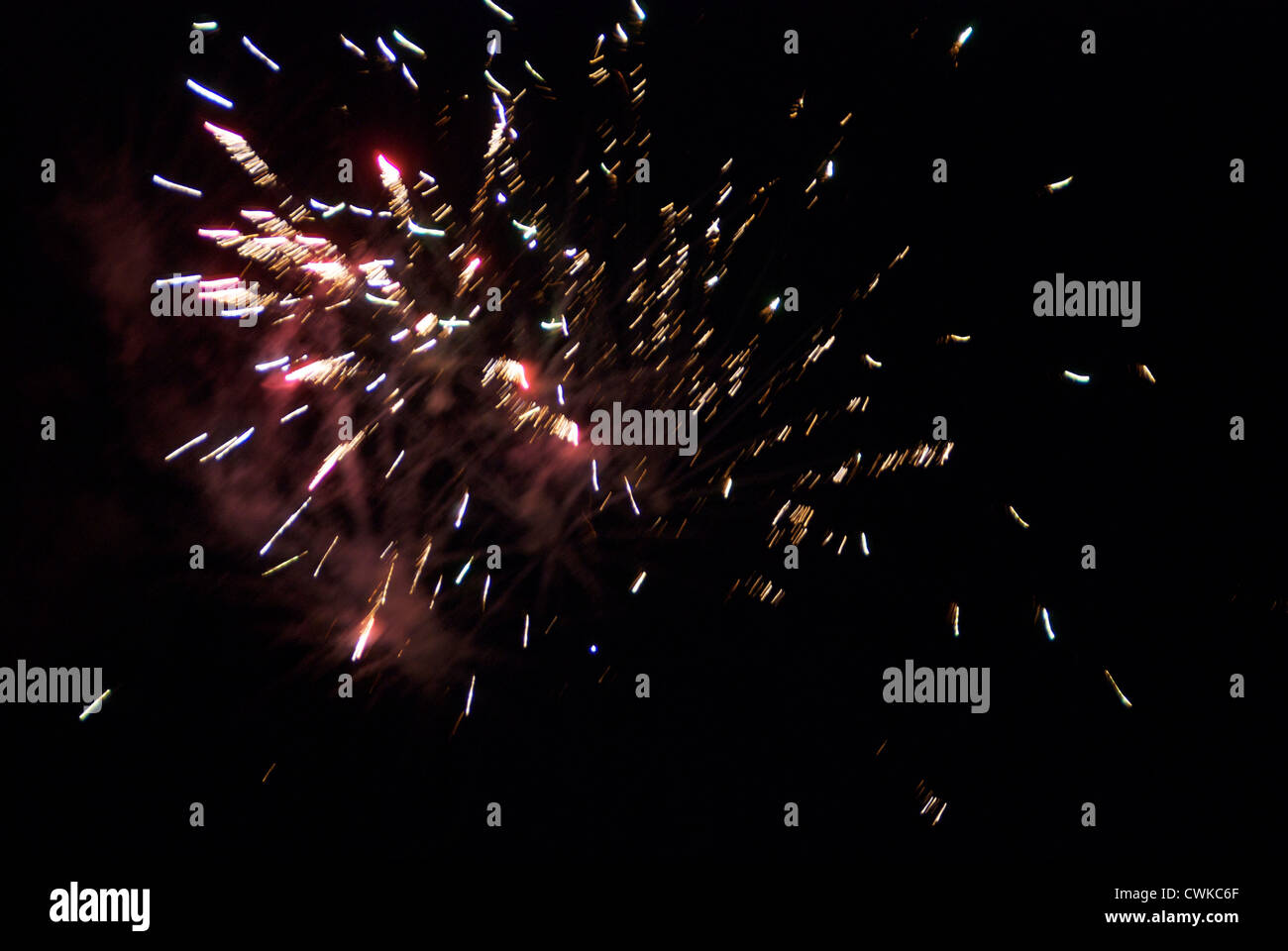 Fire works exploding against dark sky Stock Photo - Alamy