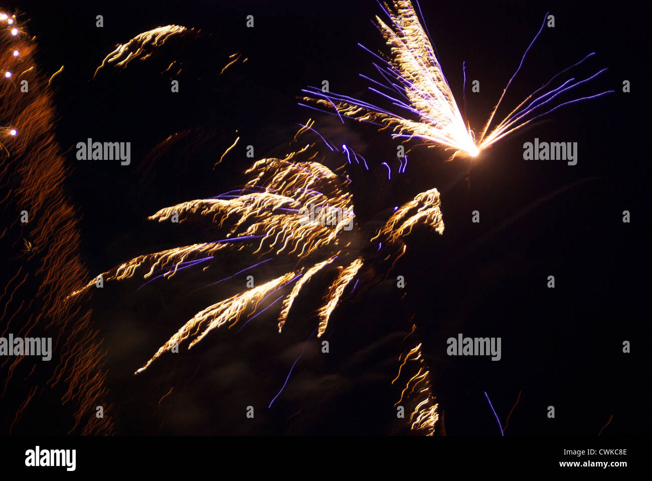 Fire works exploding against dark sky Stock Photo - Alamy
