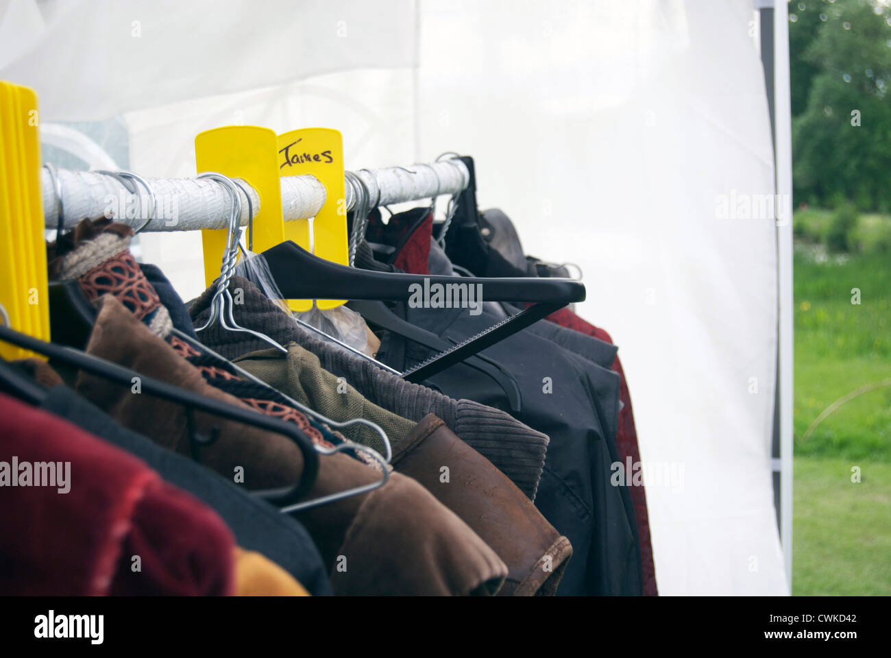 A row of costumes for actors hanging on a clothes rail Stock Photo - Alamy