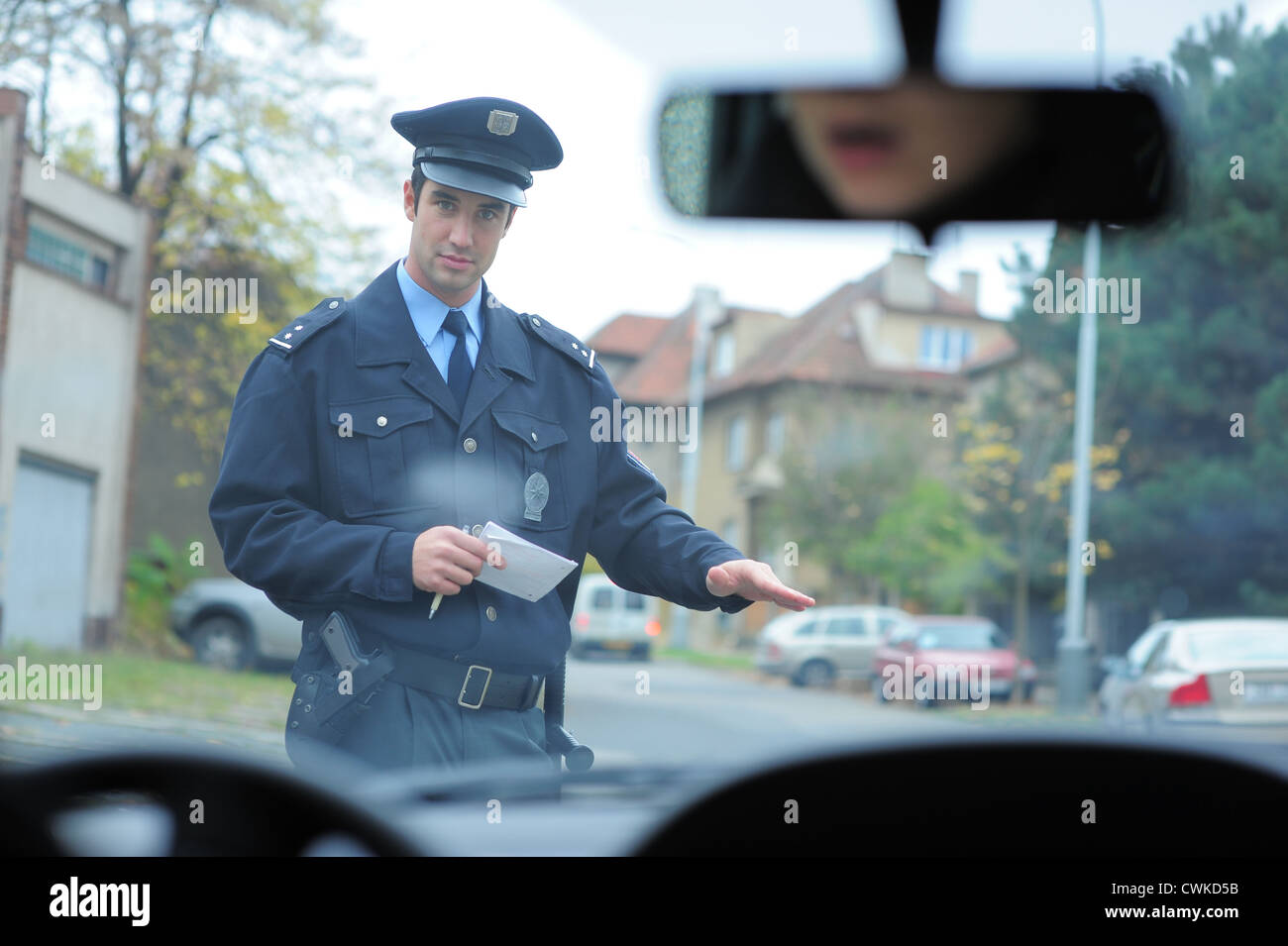 Policeman slowing down Stock Photo - Alamy