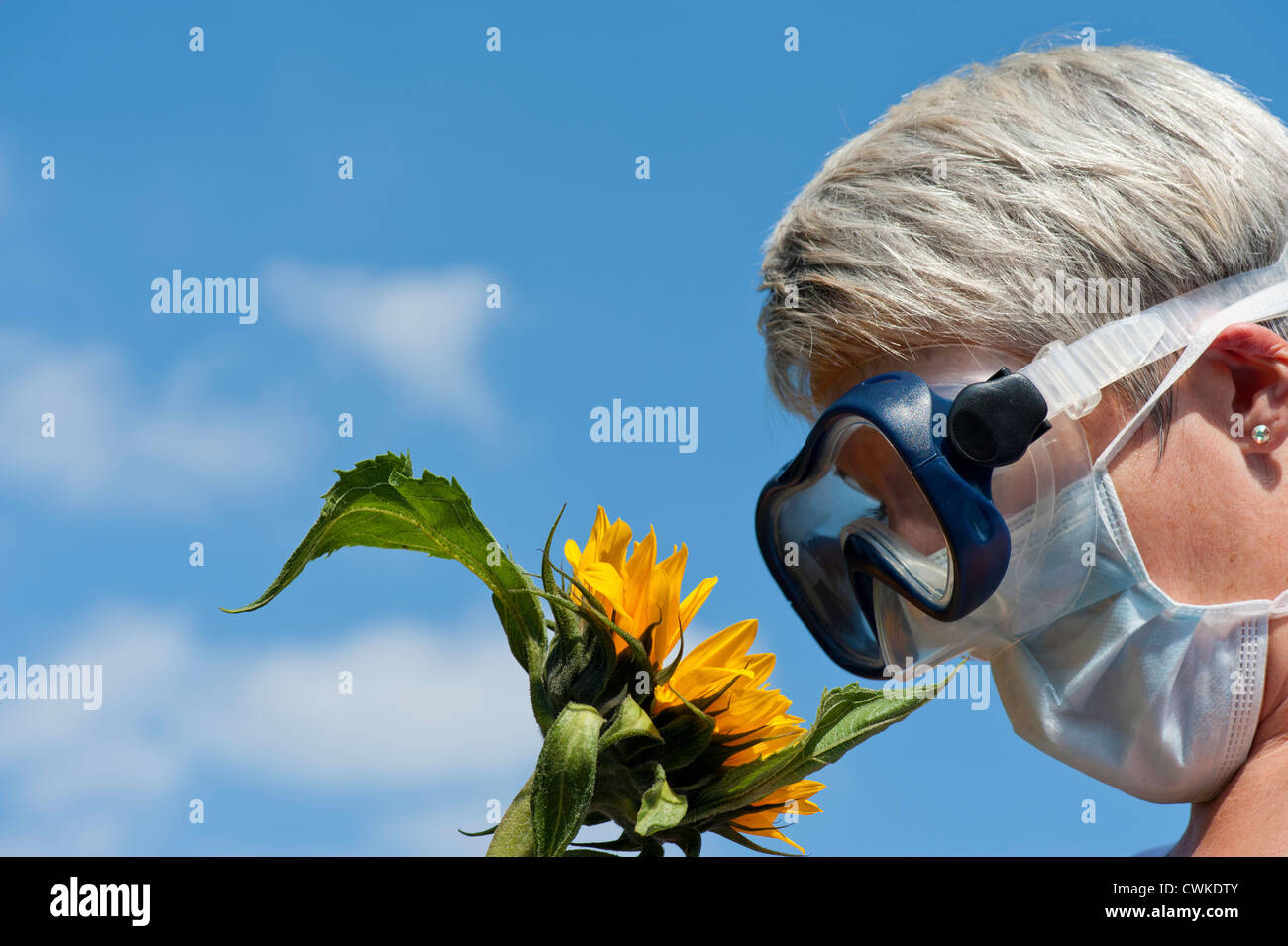 Close-up of a female adult wearing protection against hay fever looking ...