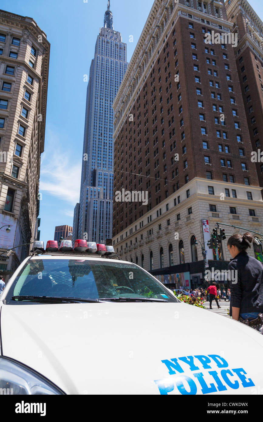 NYPD police car on streets of Manhattan, New York City, NYC with Empire ...