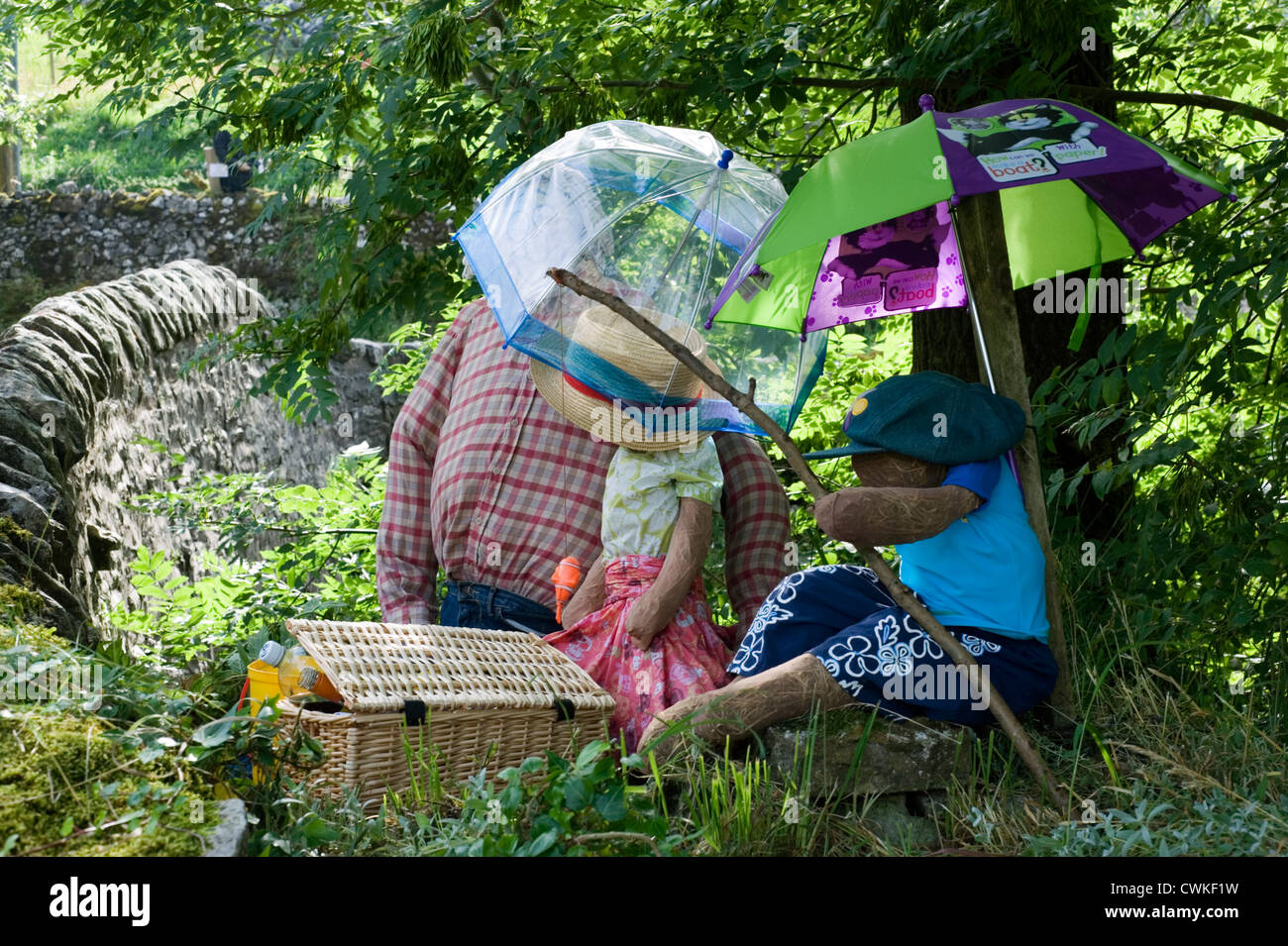 scarecrows at kettlewell festival depicting a family picnic by the ...