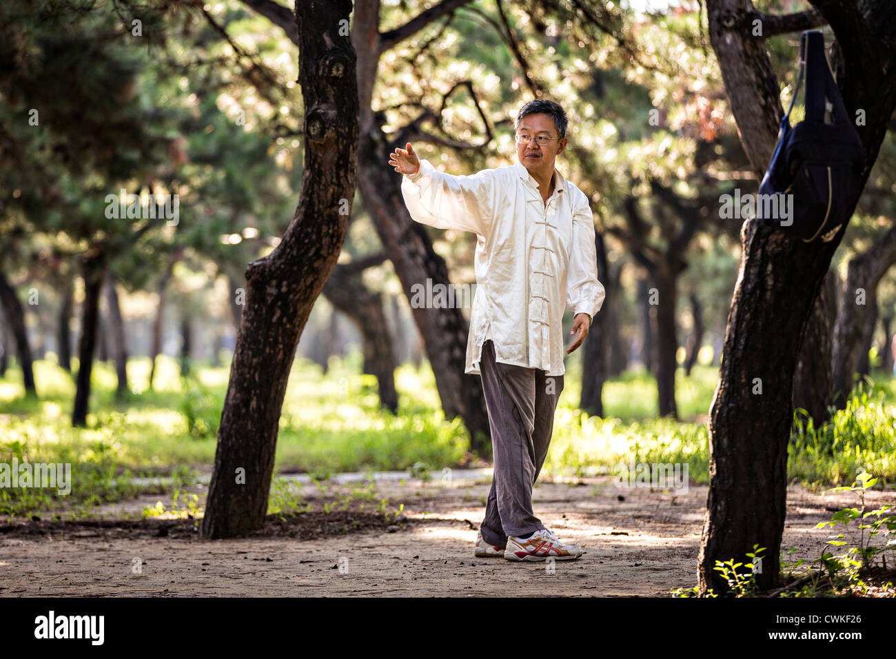 Chinese people practices tai chi martial arts exercise early morning at ...