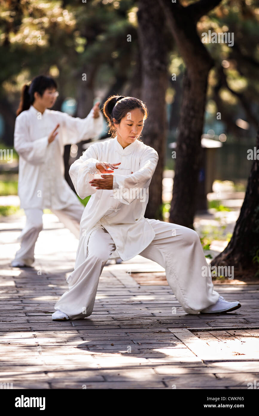 Chinese people practices tai chi martial arts exercise early morning at ...