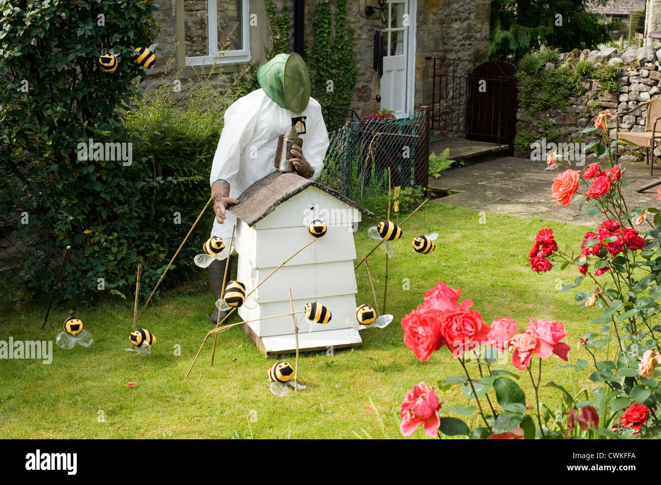 scarecrow at kettlewell festival depicting a traditional bee keeper ...