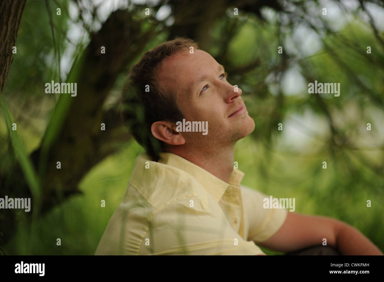Young man in nature Stock Photo - Alamy