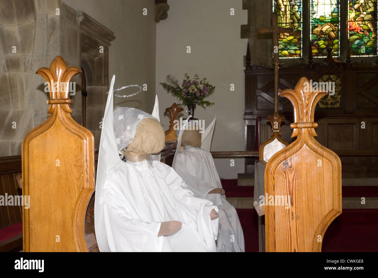scarecrows at kettlewell festival depicting angels sitting in church ...
