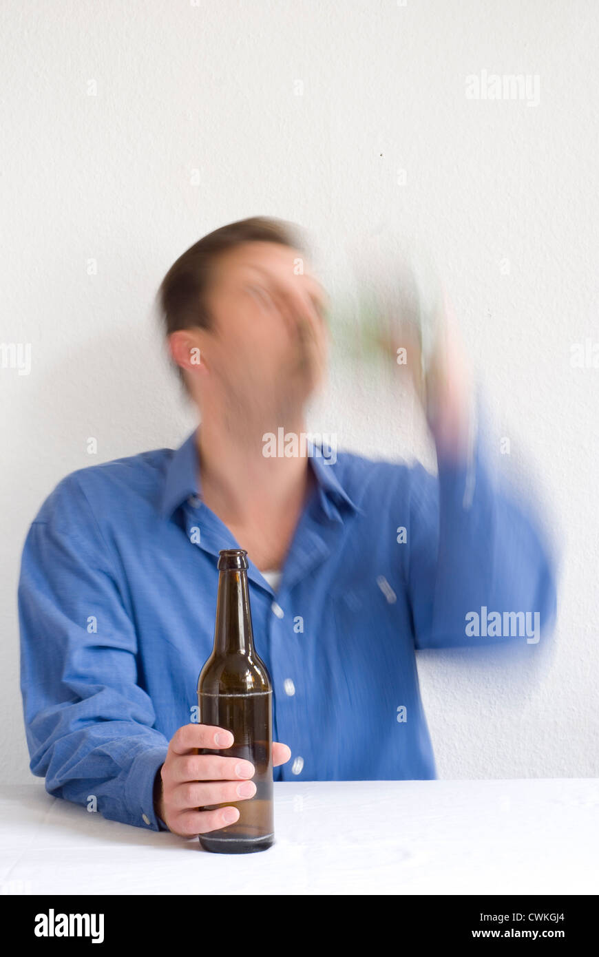 Man drinking with both hands. Above space for text Stock Photo - Alamy